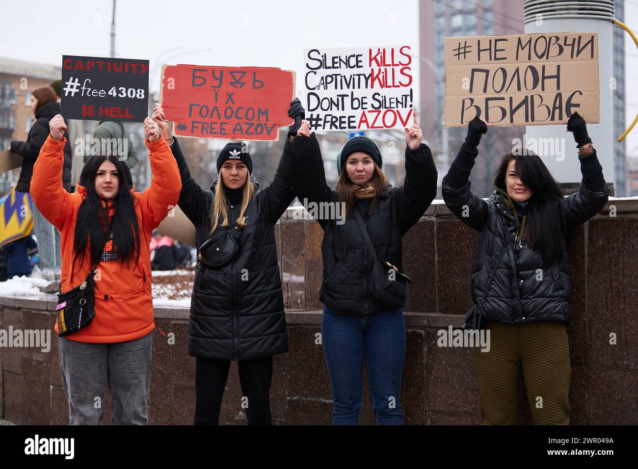 Ukrainian female activists show banners "Free Azov" and "Don't Be ...