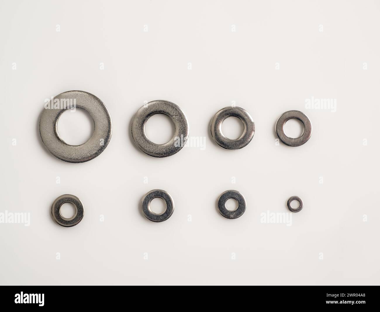 Stainless steel washers sizes M2 up to M10 isolated on a white ...