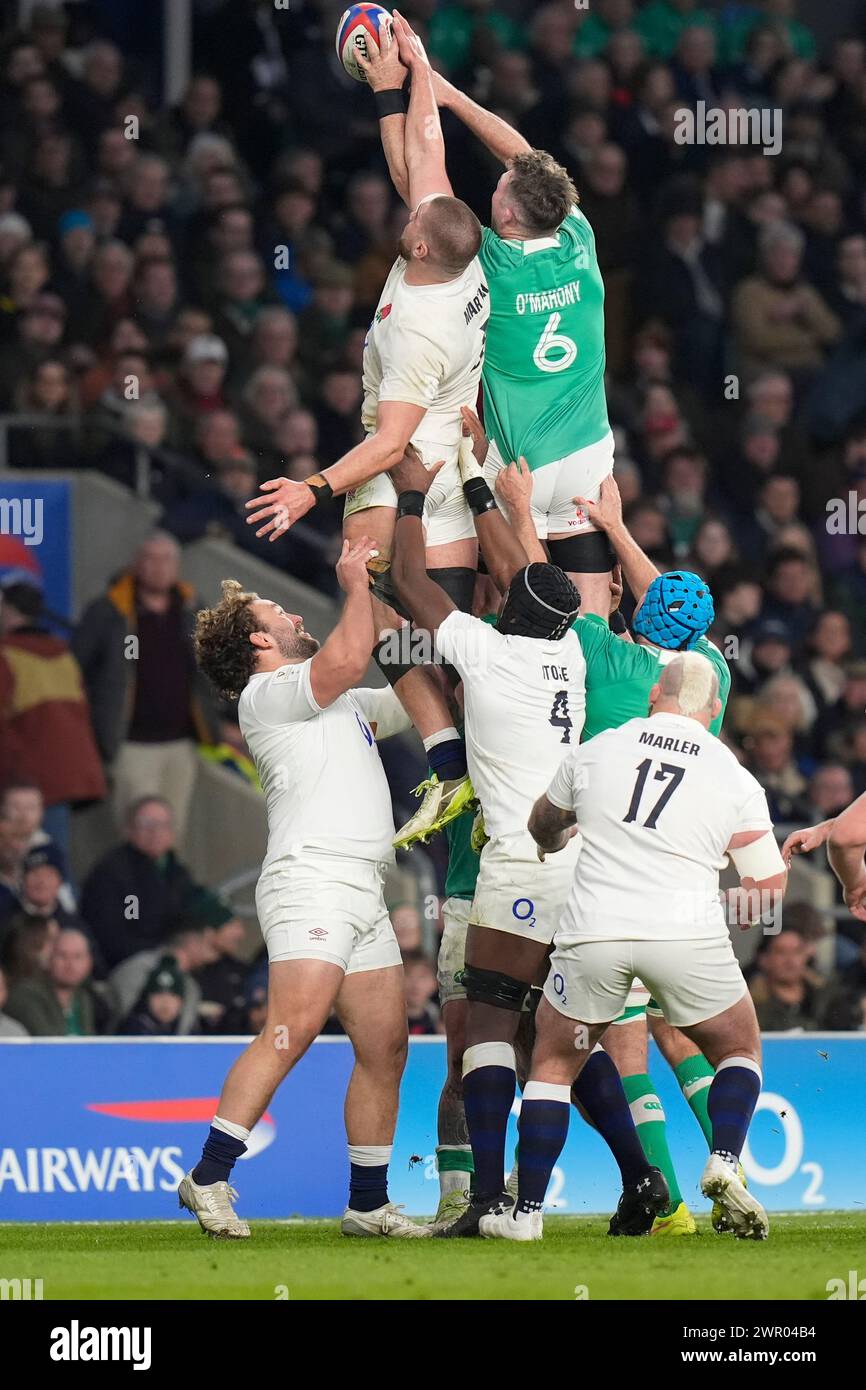 George Martin of England competes for a line-out with Peter O’Mahony of ...