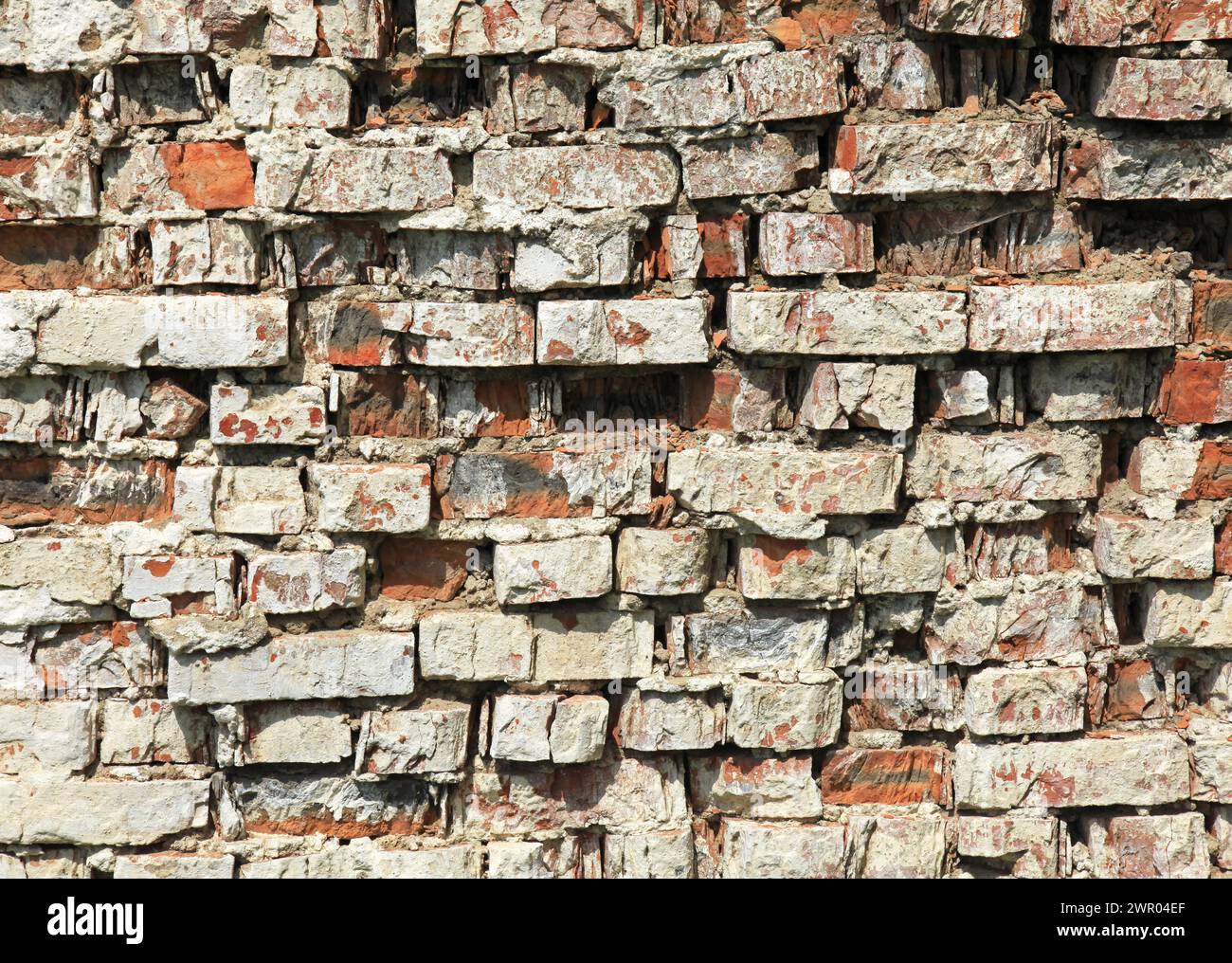 Old brick wall, texture, background. Chipped and crumbling wall, made of old red bricks ...