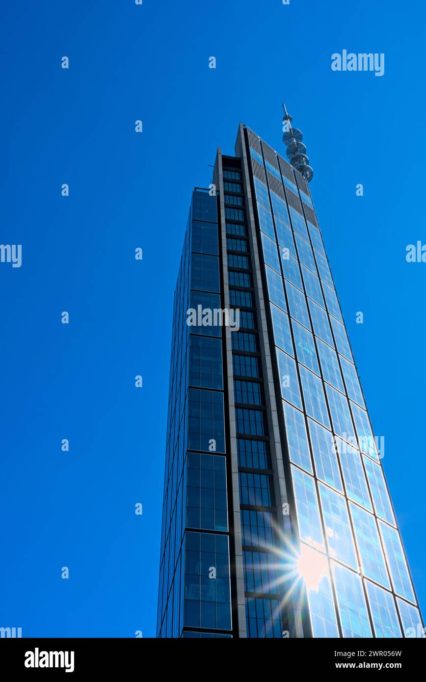 Varso Tower skyscrapper with sun reflection vertical shot of the tower ...