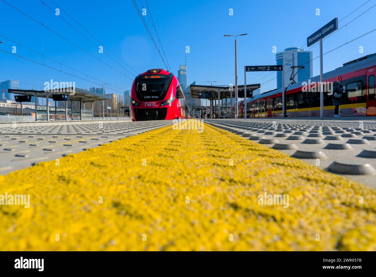 Warsaw Main Station, railway station with two trains of the fast city ...