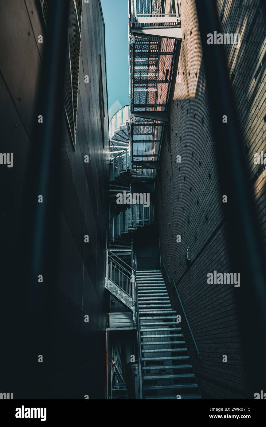Fire escape stairs between buildings Stock Photo - Alamy