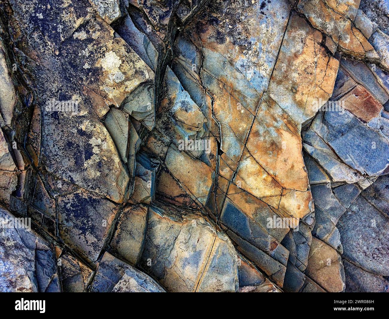 Weathered rocks with intricate patterns and a mix of dark and light ...