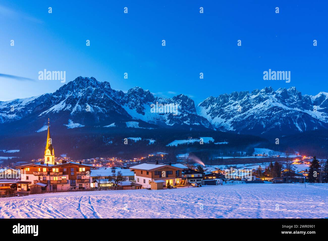 Ellmau: village Ellmau with church, Wilder Kaiser mountain range, snow ...