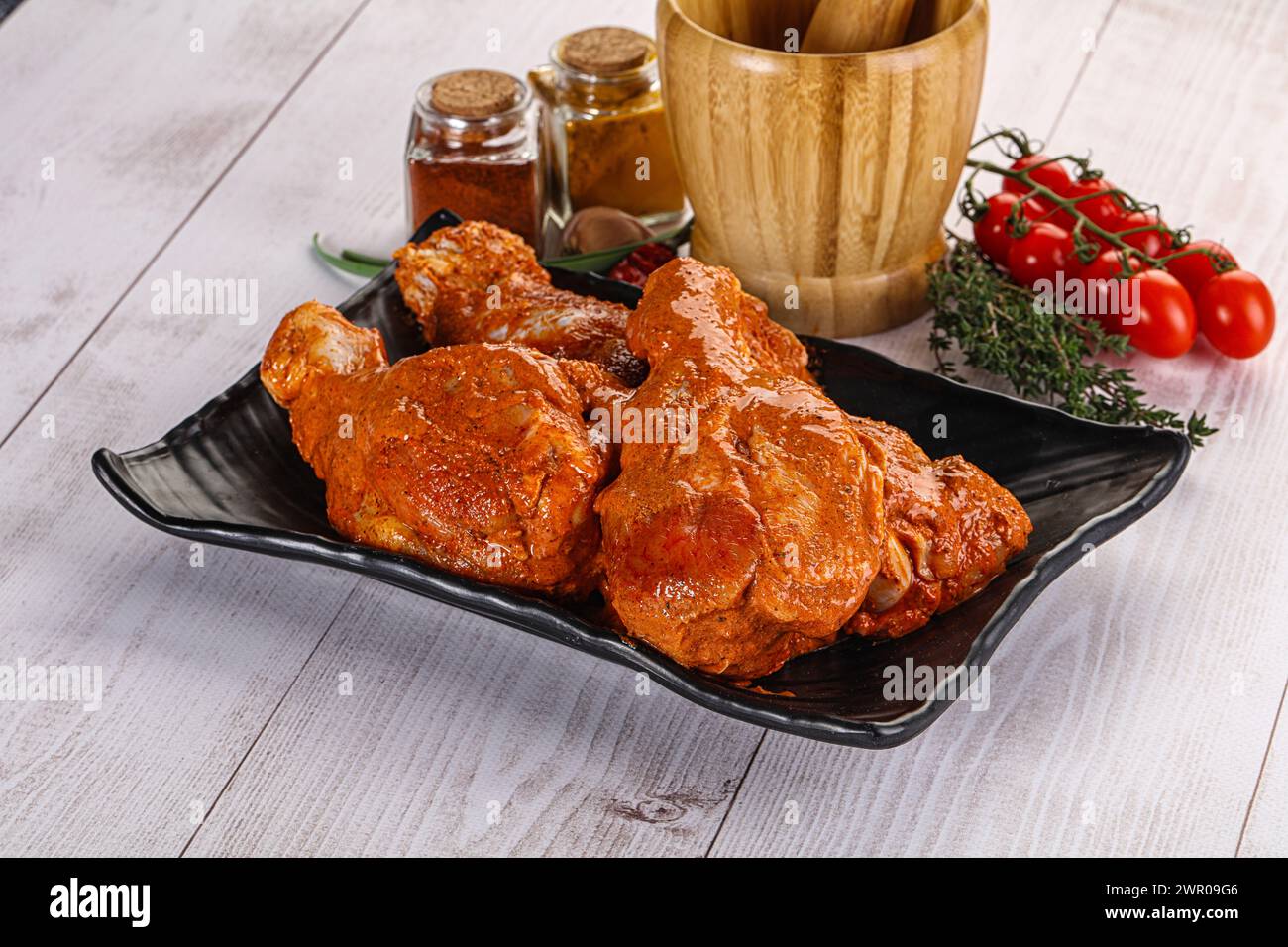 Raw turkey shoulder wing in Indian tandoori marinade spices Stock Photo ...