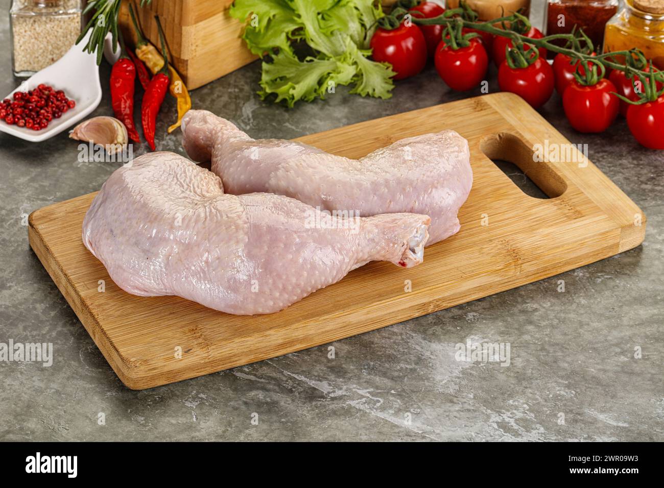 Raw chicken leg foe cooking over board Stock Photo - Alamy