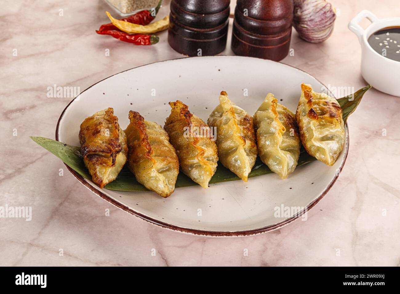 Fried Japanese stuffed dumplings - Gyoza with meat Stock Photo - Alamy