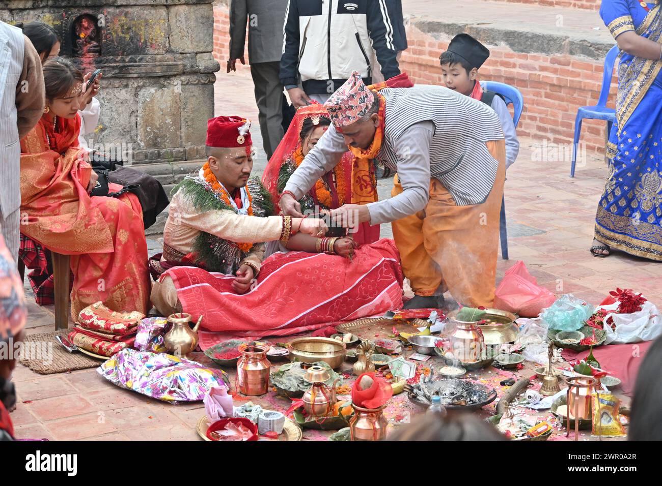 Nepalese master of ceremony celebrating a typical newari wedding in the ...