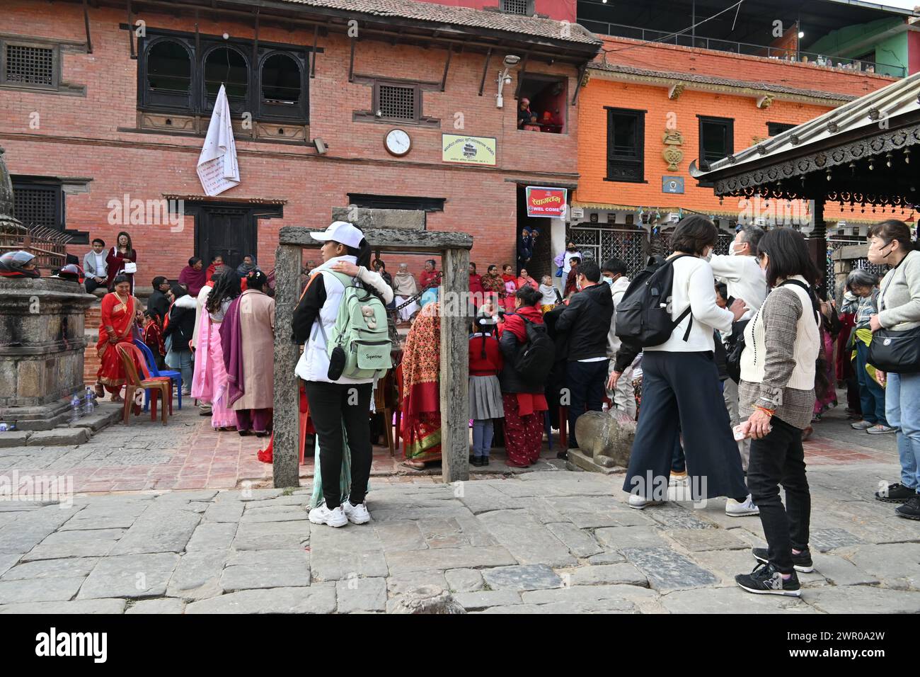 Nepalese people attending a typical newari wedding in the courtyard of ...