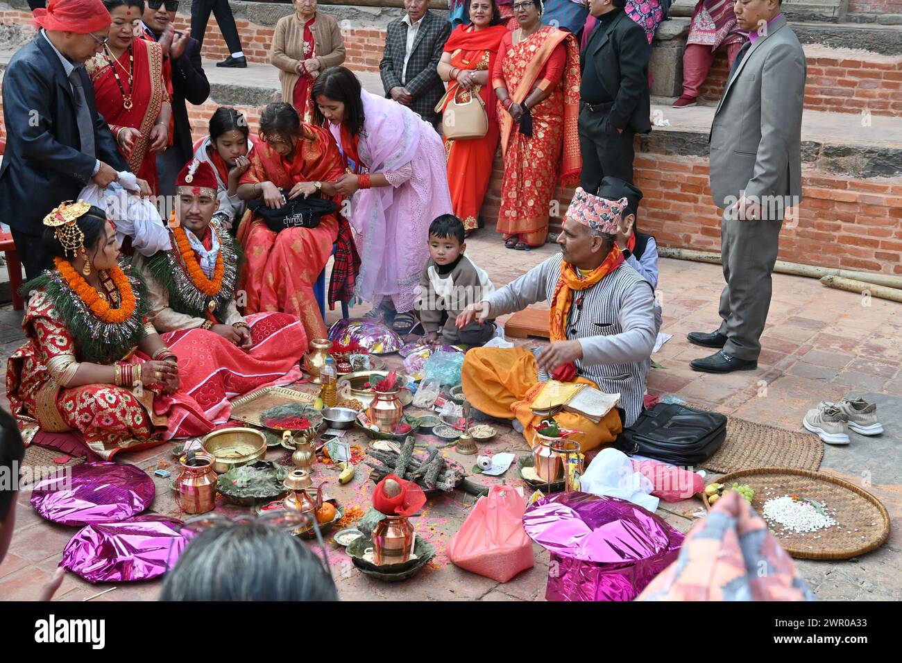 Nepalese master of ceremony celebrating a typical newari wedding in the ...