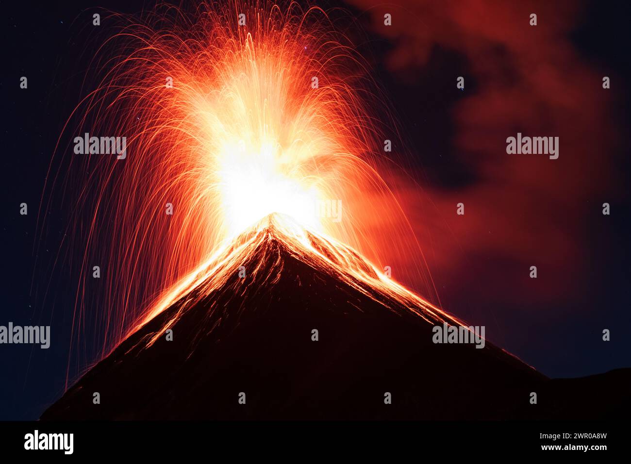 Volcano fuego erupting with a fire explosion of orange lava or magma at ...