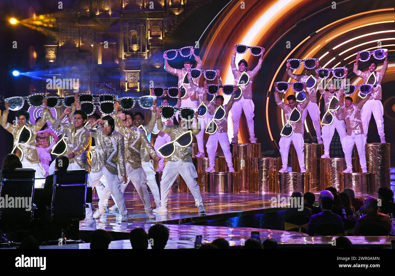 Mumbai, India. 09th Mar, 2024. Dancers using sunglasses prop perform on ...