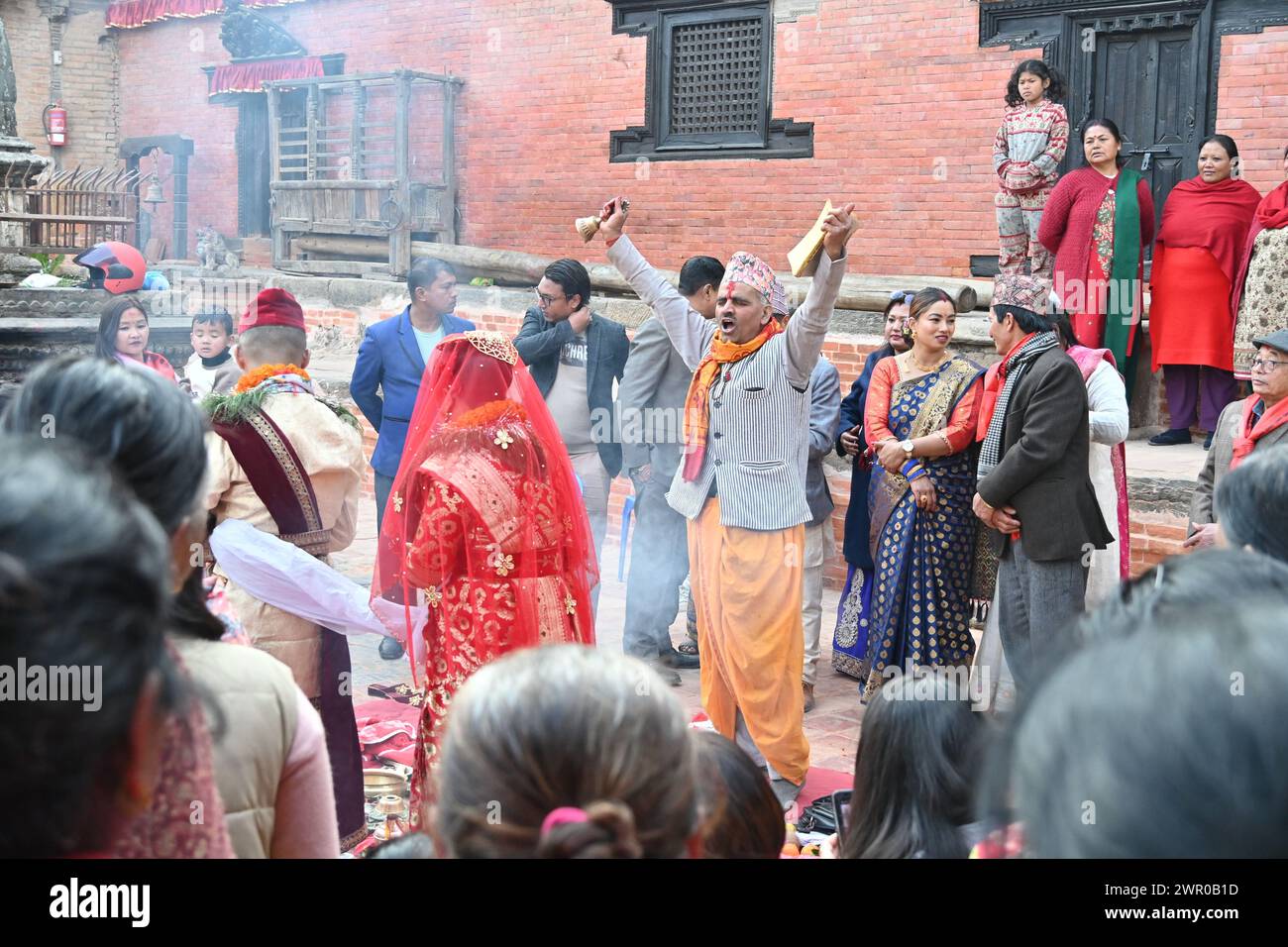 Nepalese master of ceremony celebrating a typical newari wedding in the ...