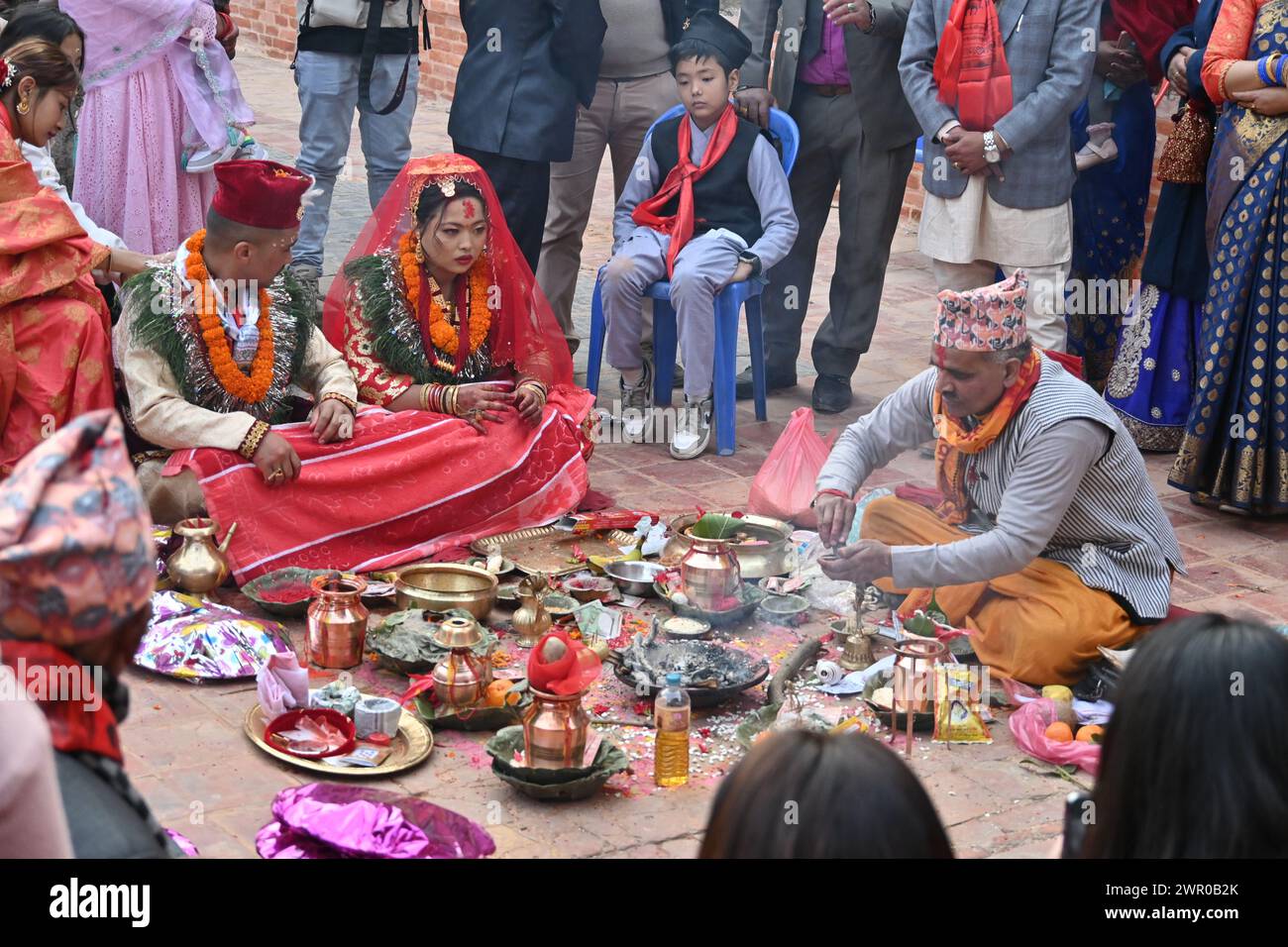 Nepalese master of ceremony celebrating a typical newari wedding in the ...