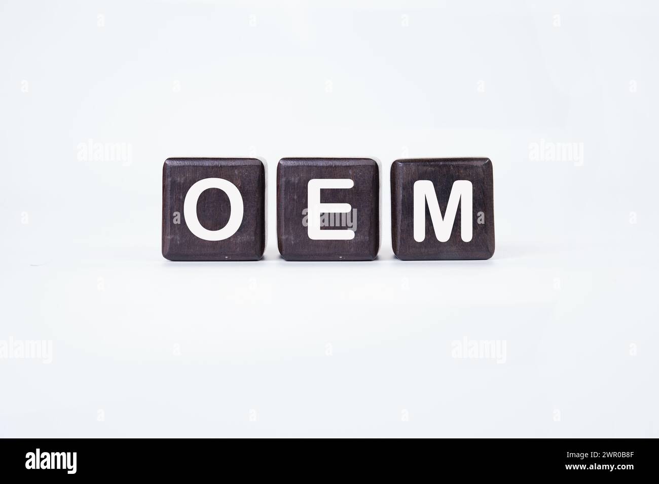 Word OEM (abbreviation of original equipment manufacturer) on cubes on ...