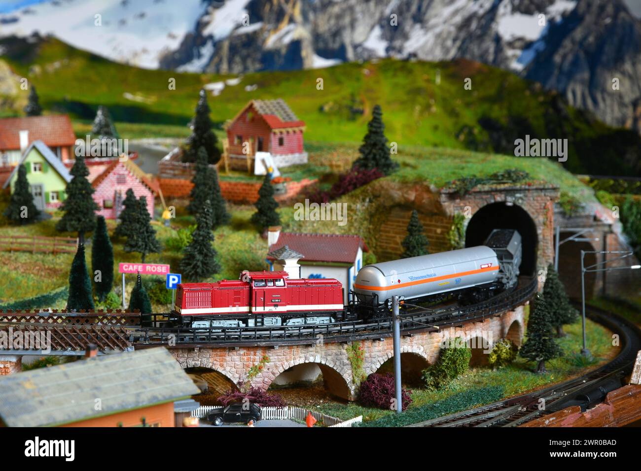 Miniature railway model with model freight train that exit from a ...