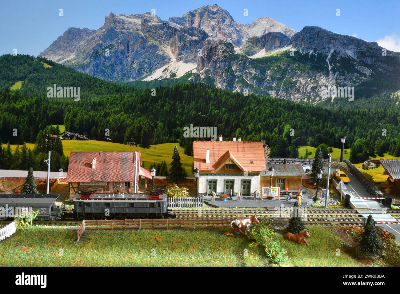 Miniature railway model with model freight train on a mountains ...