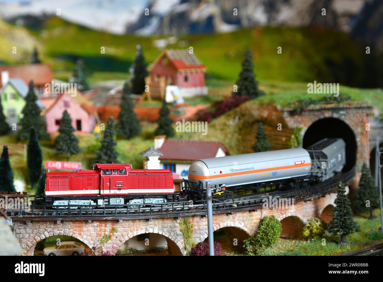 Miniature railway model with model freight train that exit from a ...