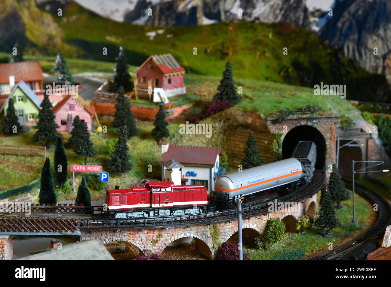 Miniature railway model with model freight train that exit from a ...
