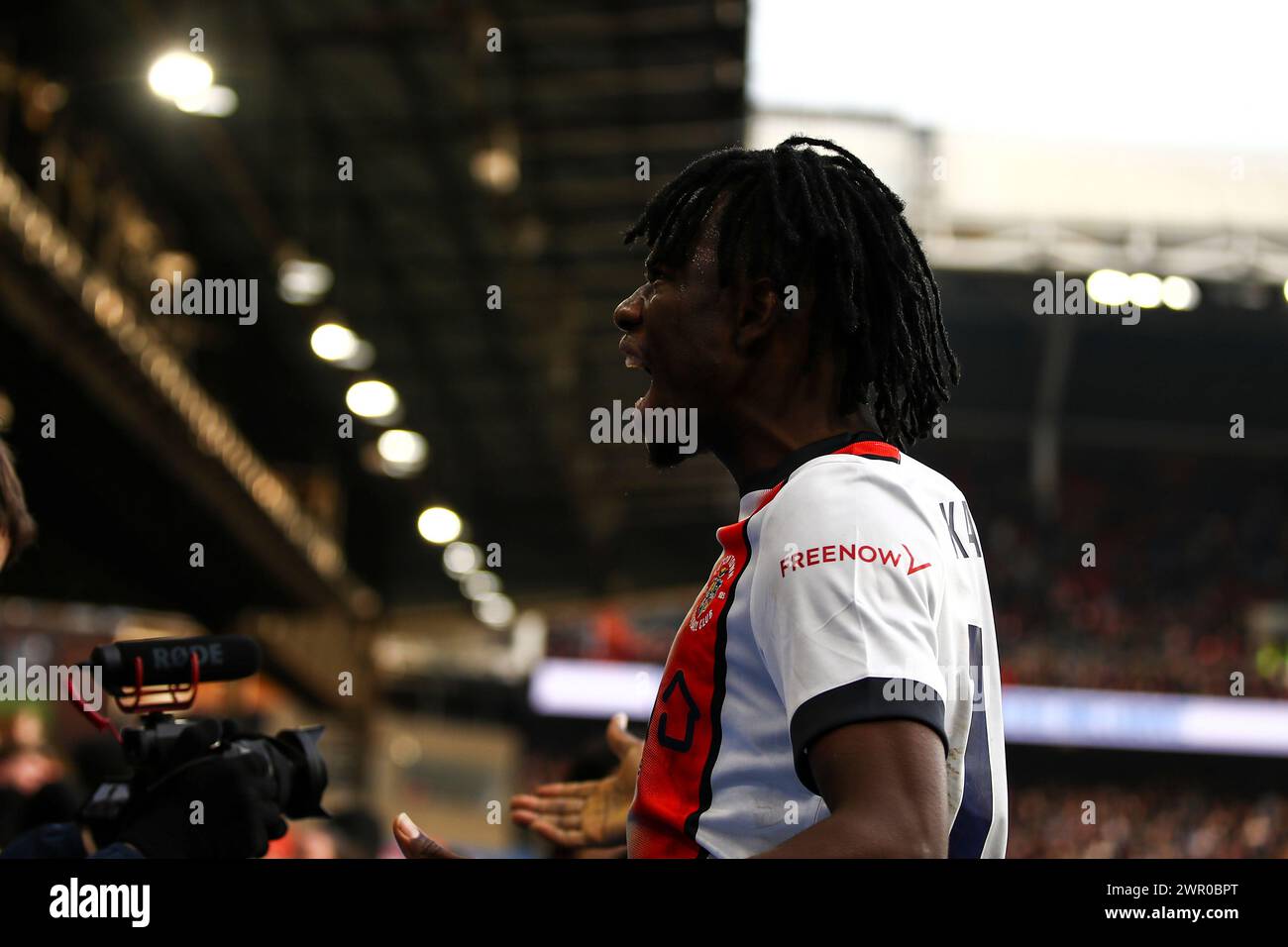 Issa Kabore of Luton Town celebrates the goal of Cauley Woodrow during ...