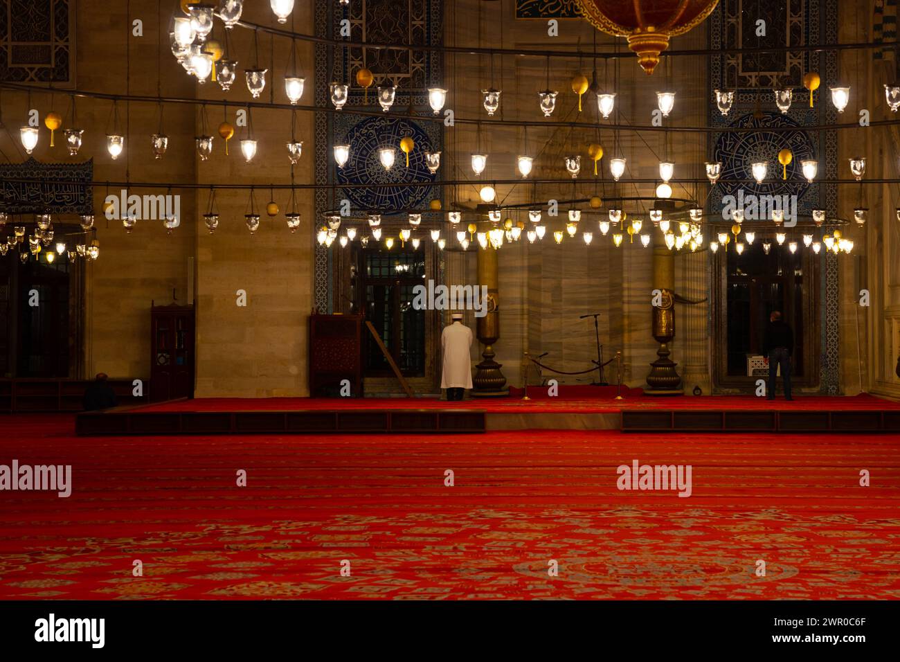 Islamic background photo. A muslim man praying alone in the mosque ...