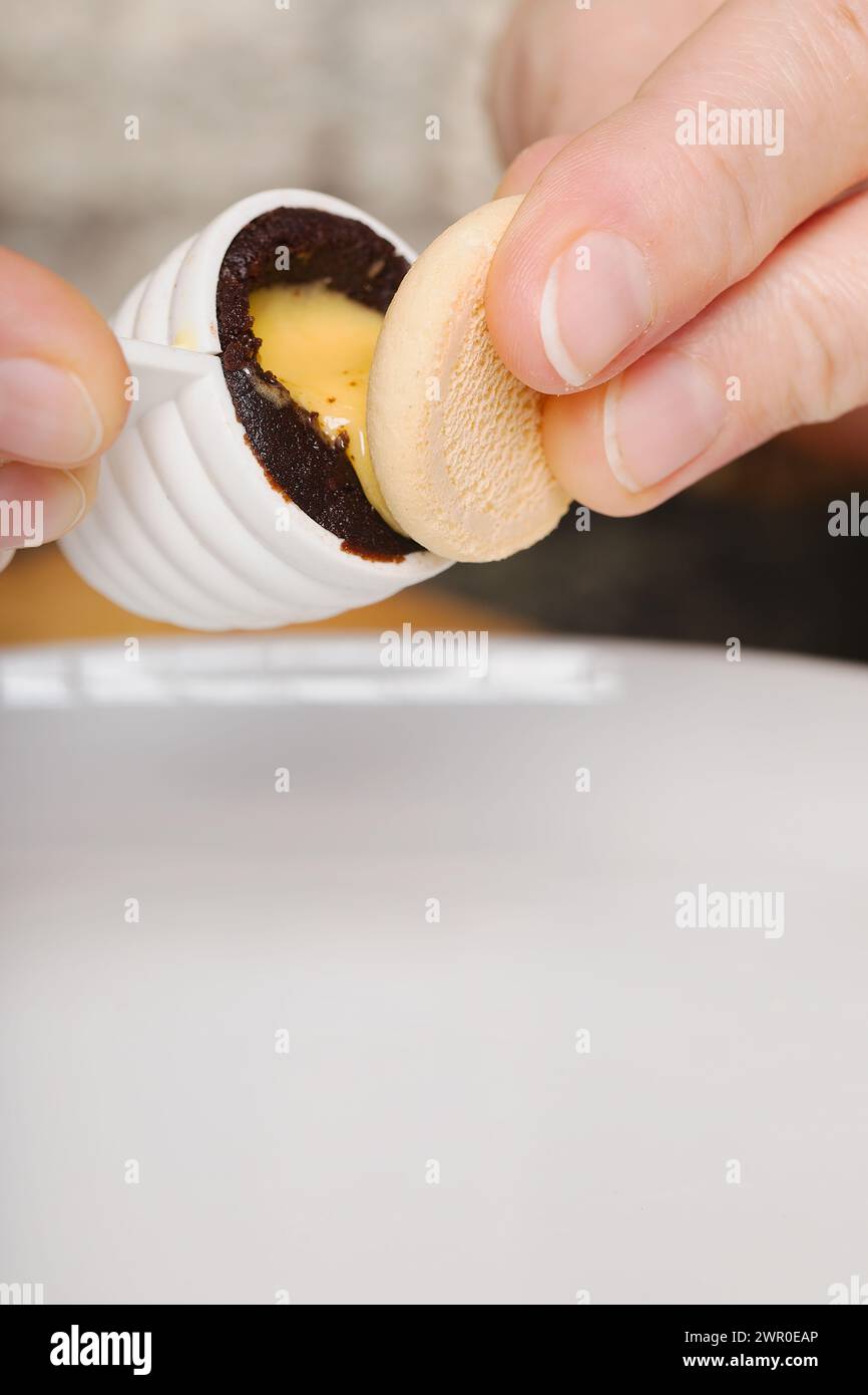 Filling of traditional christmas sweets bee hives with yolk creme Stock ...