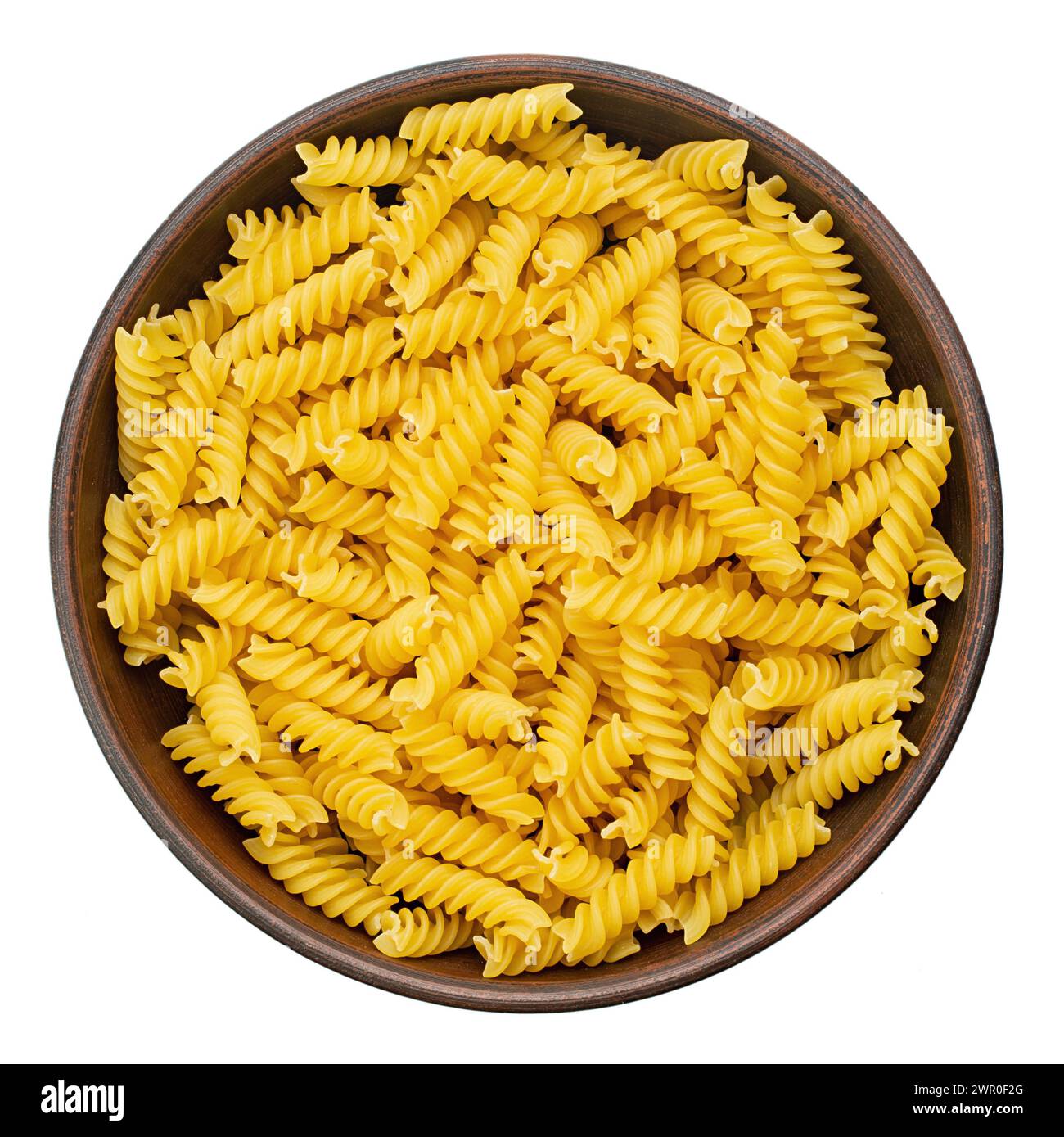 Raw pasta Fusilli in bowl isolated on white background. Raw and Dry ...