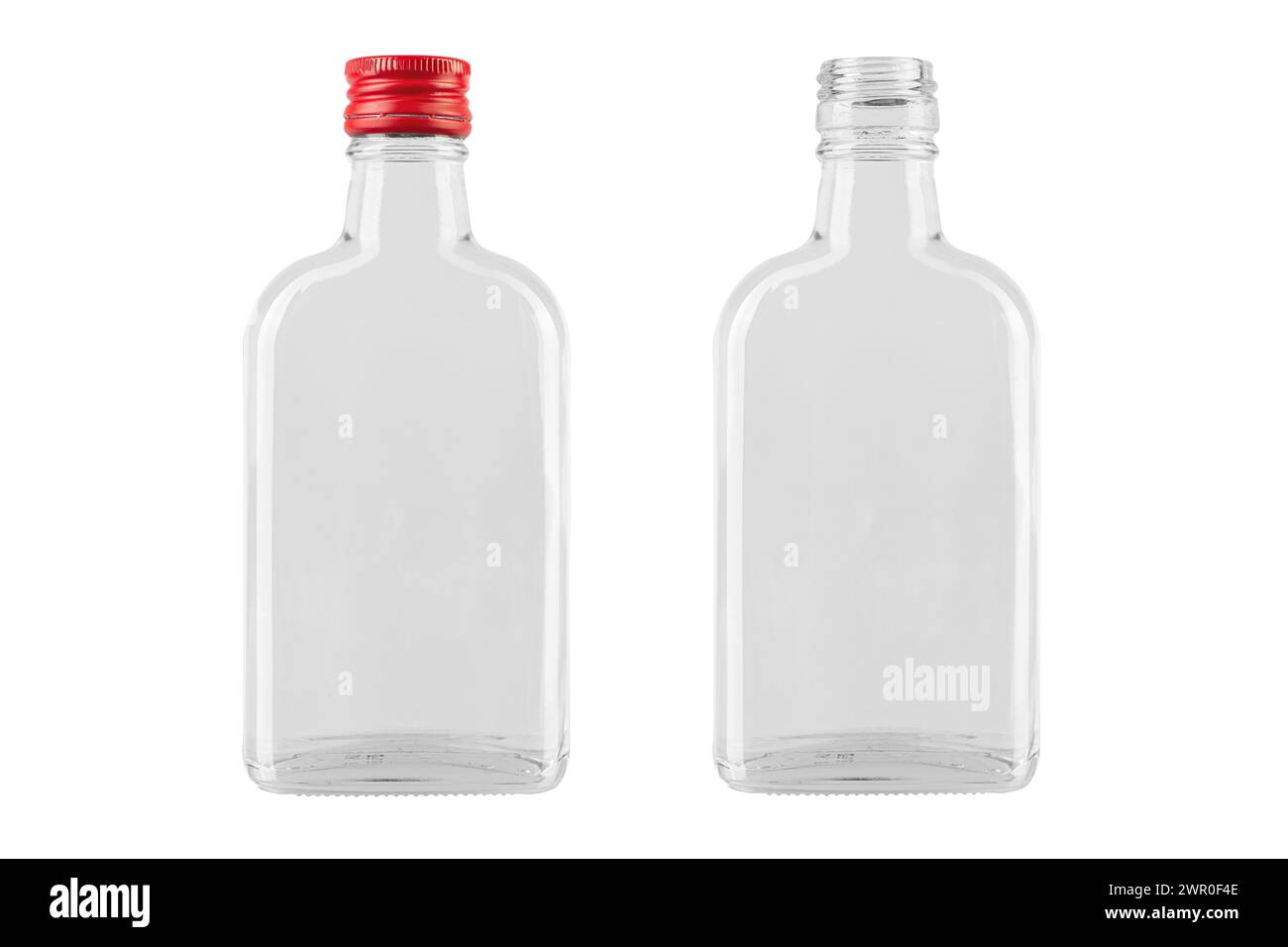 Empty glass bottle with a red cap from a medicine or an alcoholic drink ...