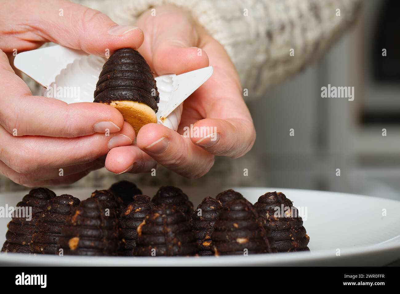 Extraction of traditional christmas sweets bee hives from plastic form ...