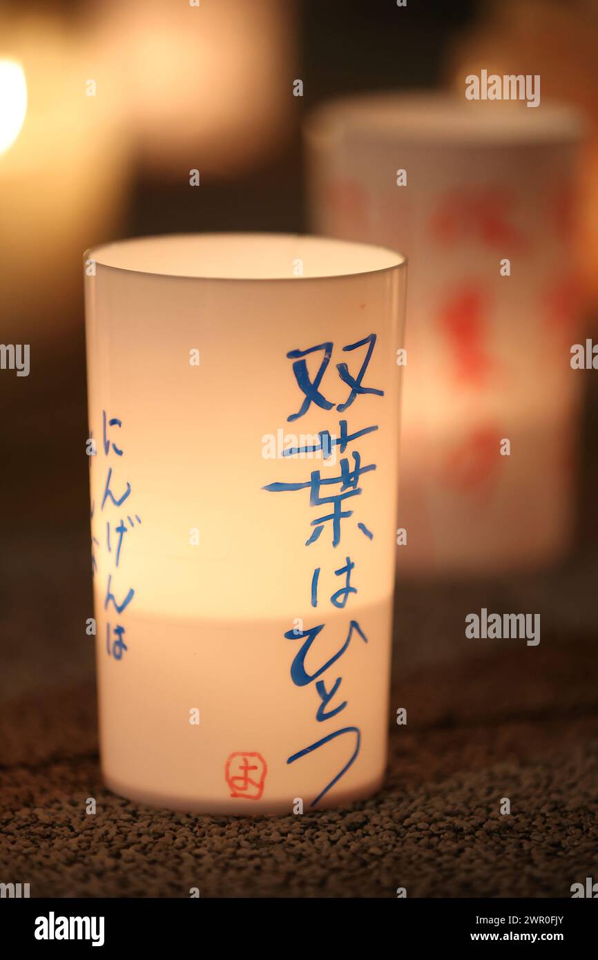 Candles are lit up to mourn the victims the Great East Earthquake and ...