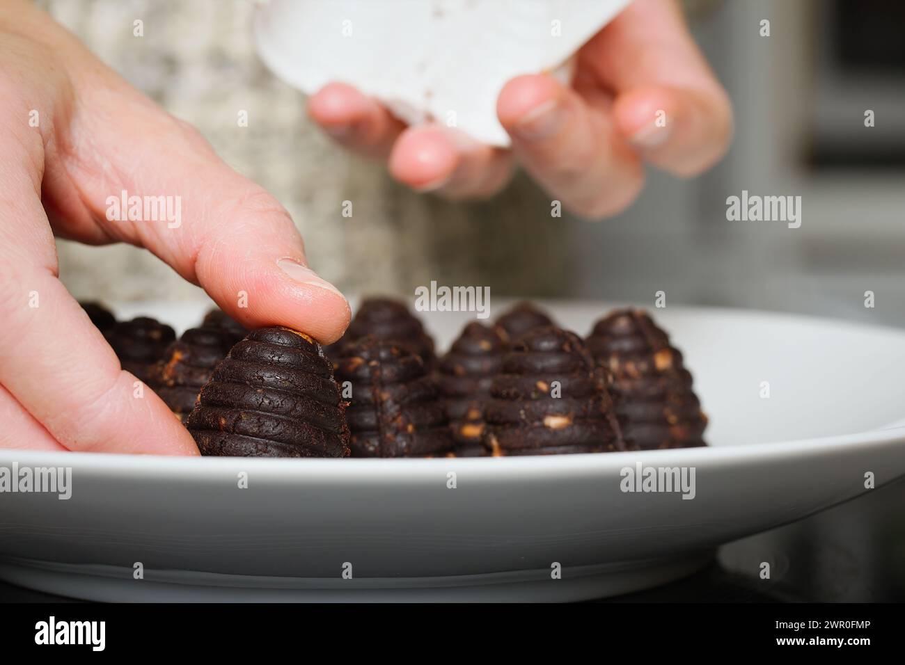 Extraction of traditional christmas sweets bee hives from plastic form ...
