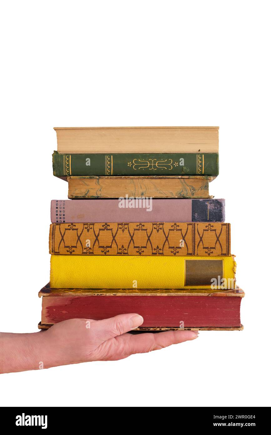 female hand and a stack of books,education,knowledge,library,back to ...