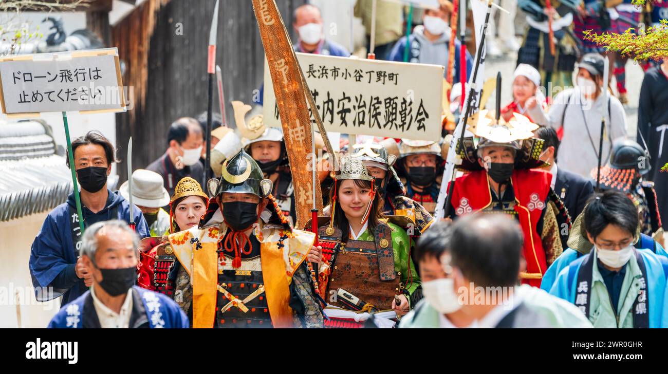 Compressed perspective view of a parade of Japanese people dressed in ...