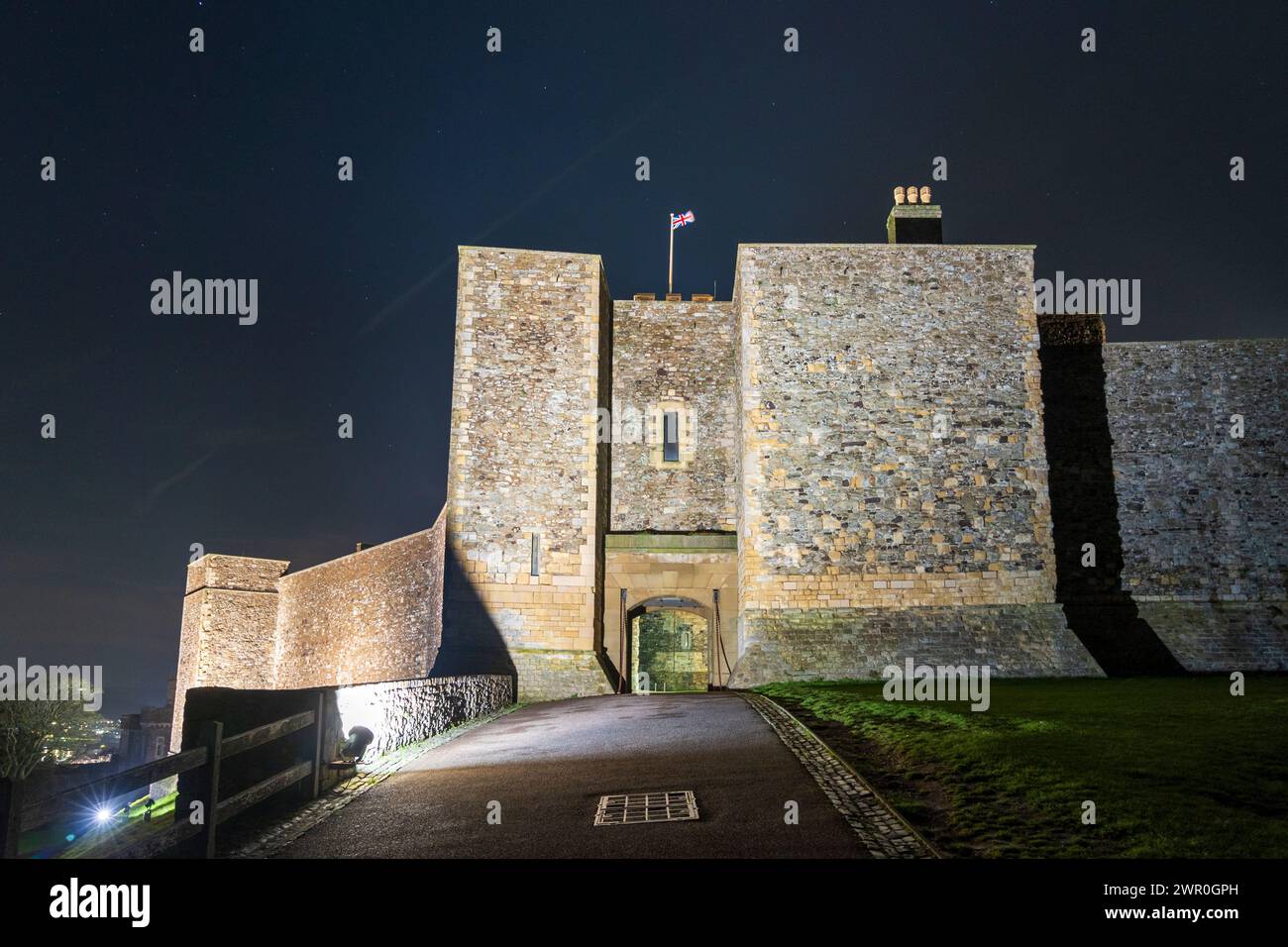 Gate and drawbridge into the inner bailey and the Great Keep at Dover castle in England at night ...