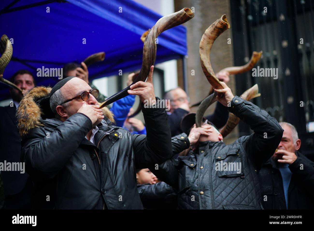 People blowing shofars and whistles in Abbey Road, London, led by ...