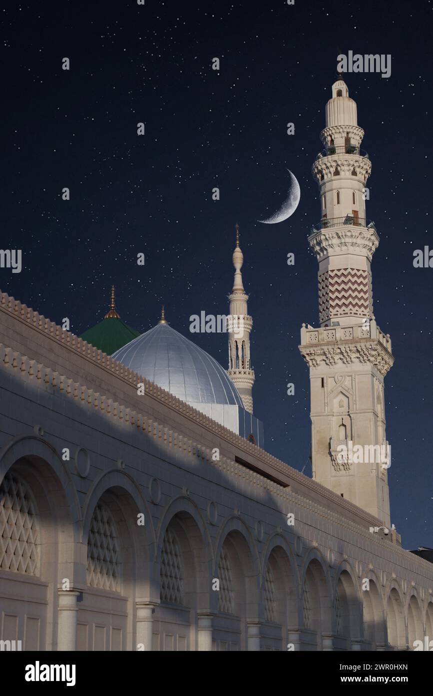 A mosque with the full moon in the sky. Masjid nabi of Medina, mosque ...