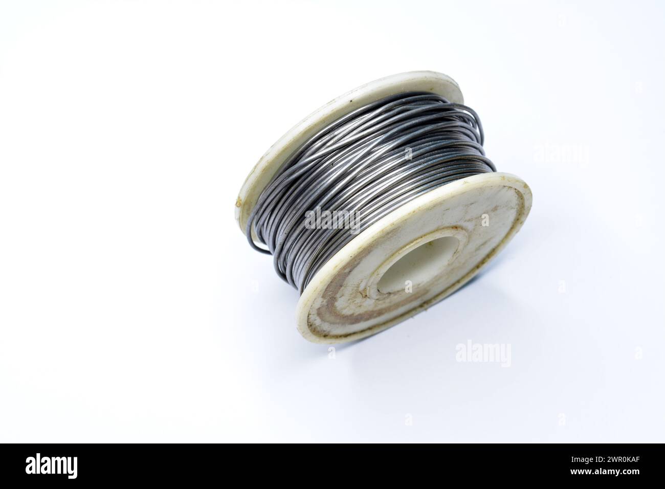 Lead Solder Spool isolated on white background Stock Photo - Alamy