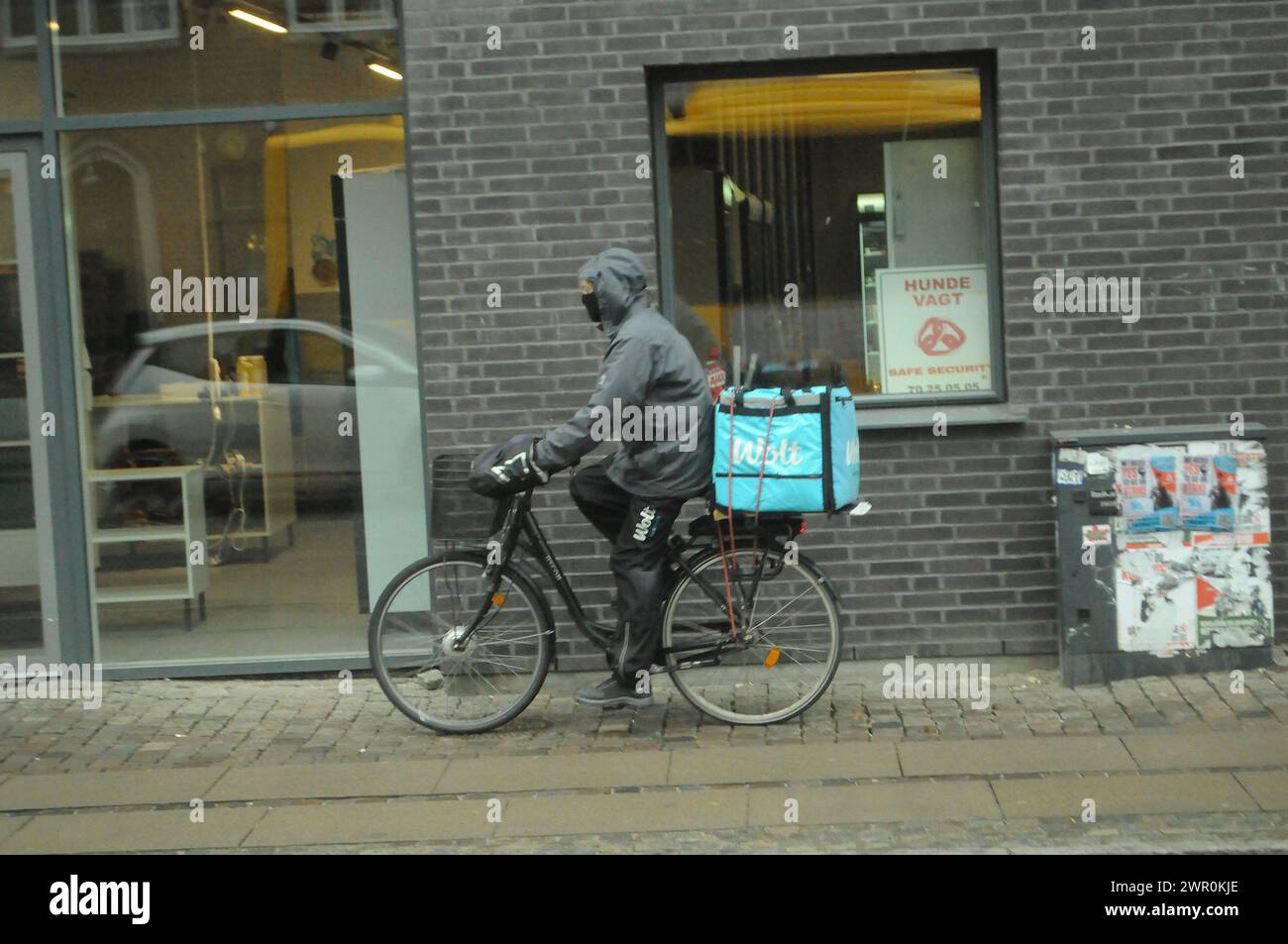 Copenhagen, Denmark /10 March 2024/. Wolt partner food delivery bikers ...