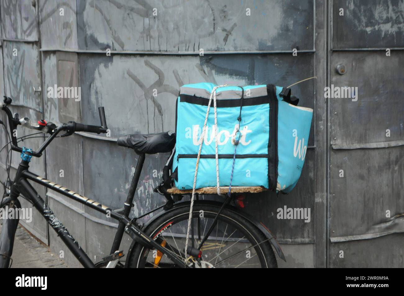 Copenhagen, Denmark /10 March 2024/. Wolt partner food delivery bikers and store in danish ...