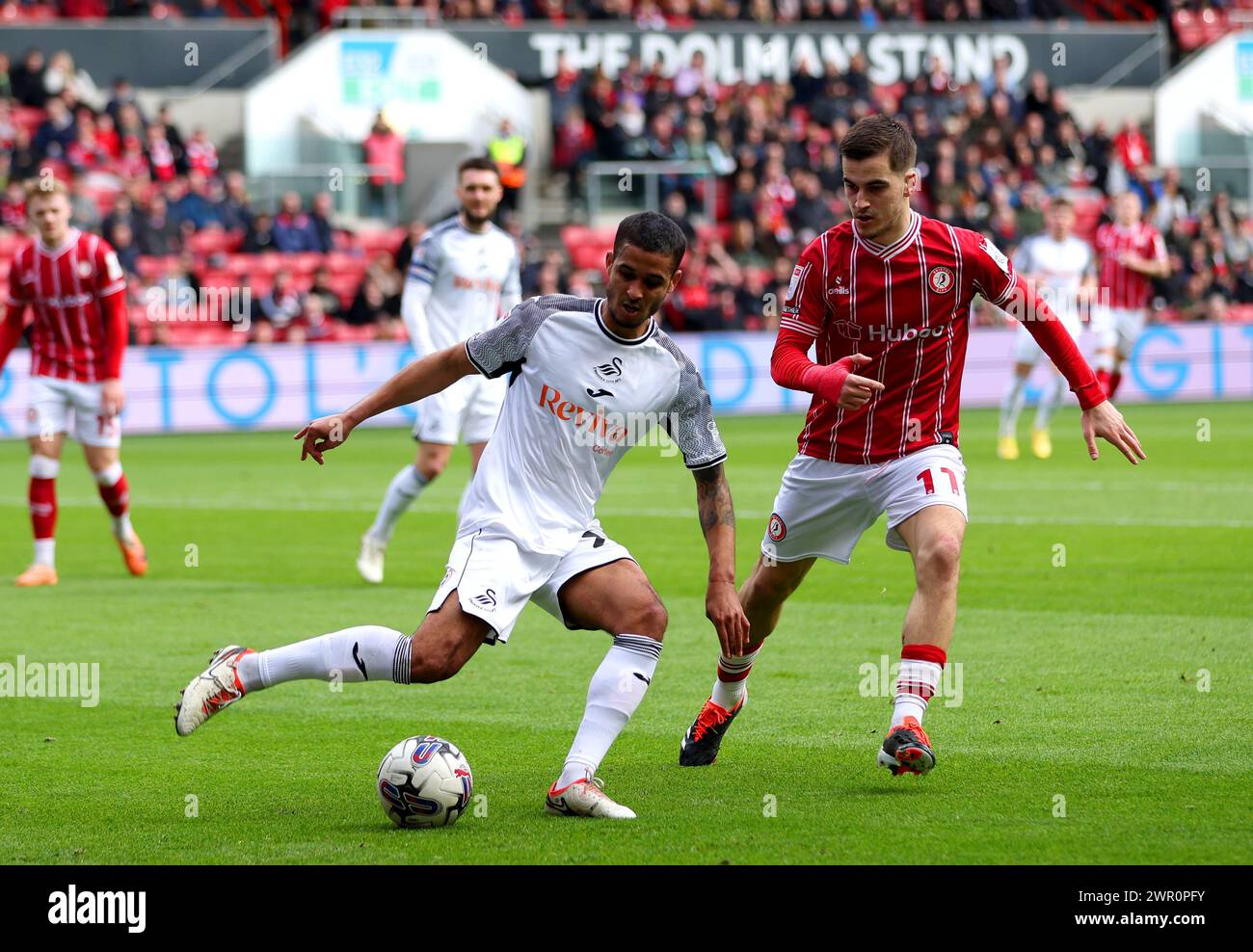 Swansea City's Kyle Naughton (left) and Bristol City's Anis Mehmeti ...