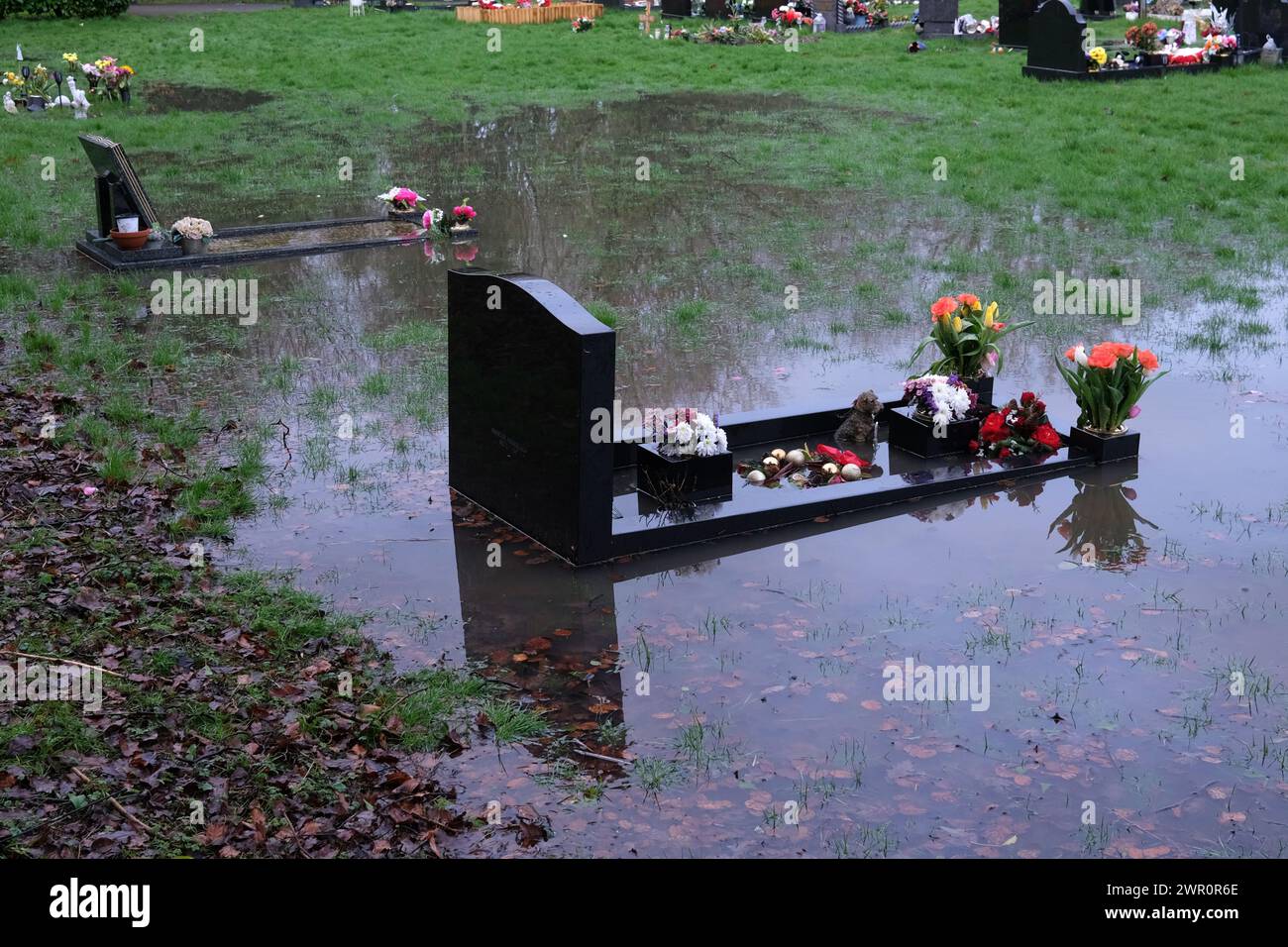Waterlogged graves at cemetery in Britain, Uk Stock Photo - Alamy