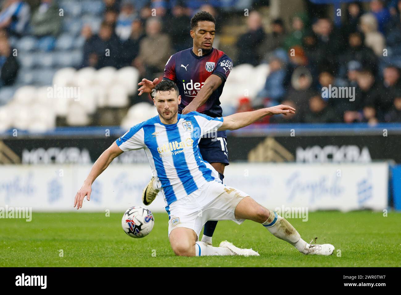 Huddersfield Town's Matty Pearson (left) and West Bromwich Albion's ...