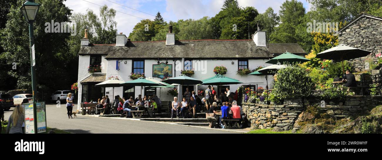 Summer view over the Britannia Inn at Elterwater village, Langdale ...