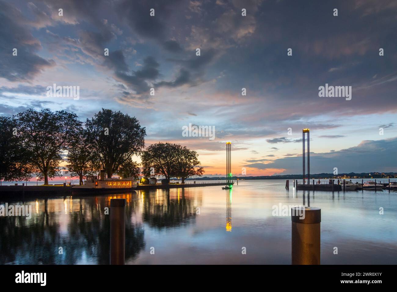 Bregenz: lake Bodensee (Lake Constance), harbor, boat, sunset ...