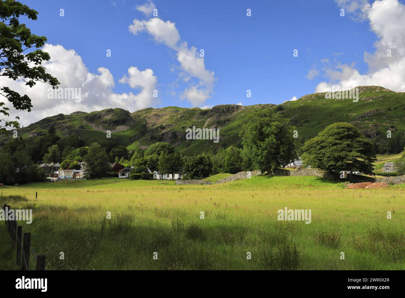 Summer view over Elterwater village, Langdale, Lake District National ...