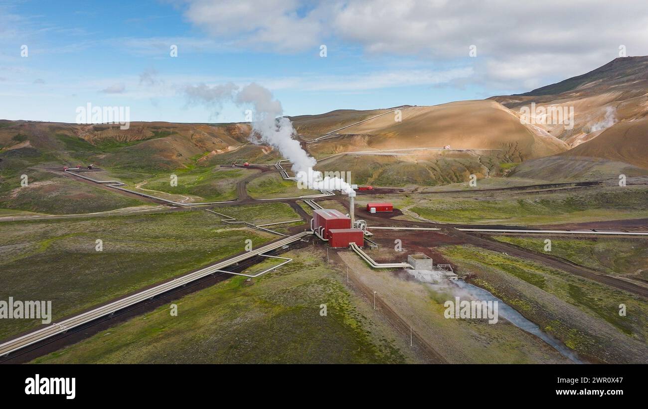 Geothermal power station in Icelandic landscape, steaming chimneys in ...