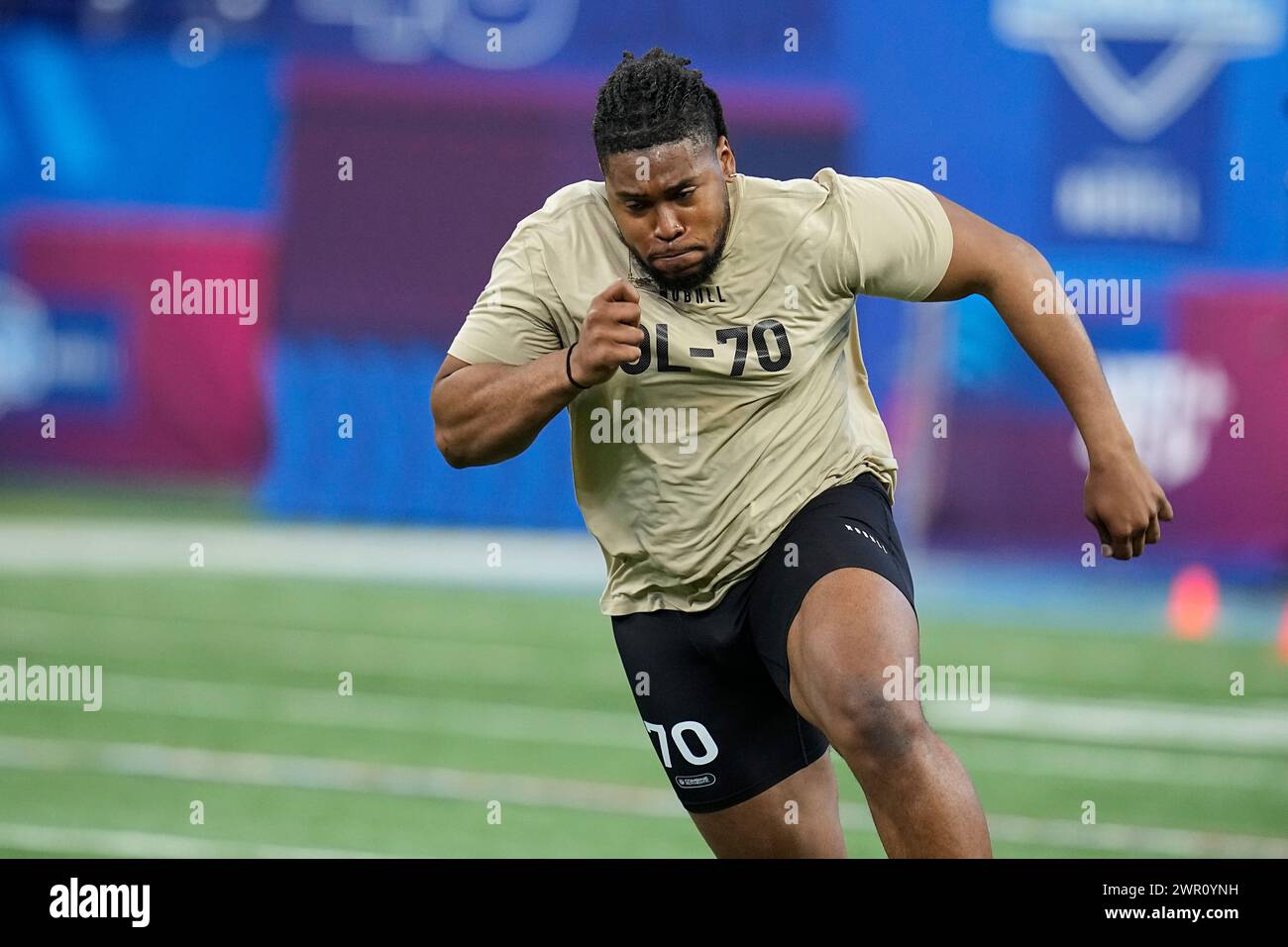 Penn State offensive lineman Caedan Wallace runs a drill at the NFL ...