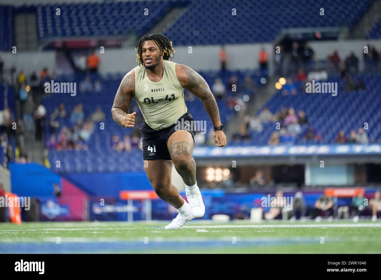Alabama offensive lineman JC Latham runs a drill at the NFL football ...