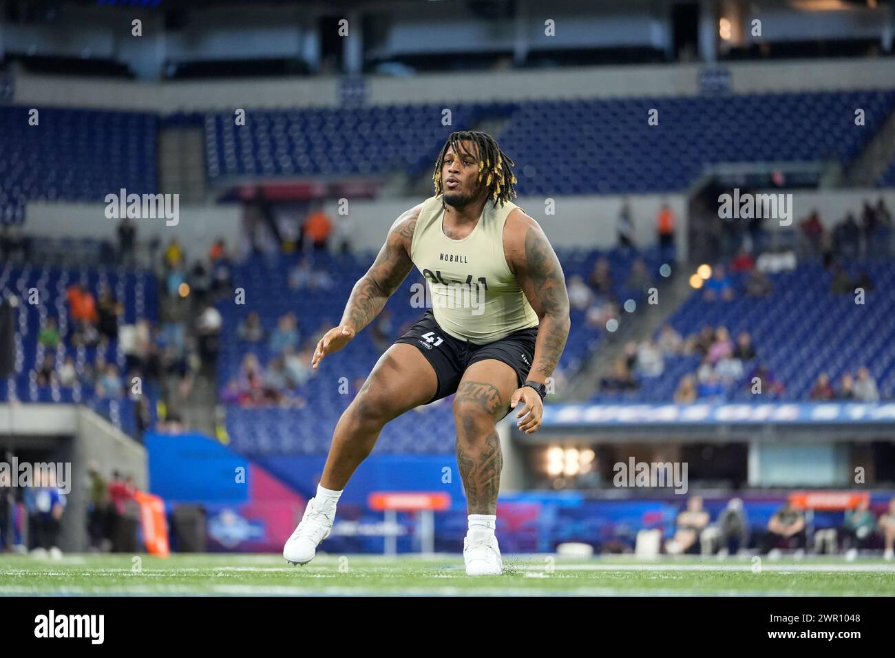 Alabama offensive lineman JC Latham runs a drill at the NFL football ...